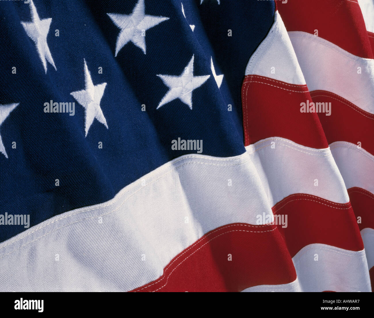 This is an American flag with waves folding over the blue field of ...
