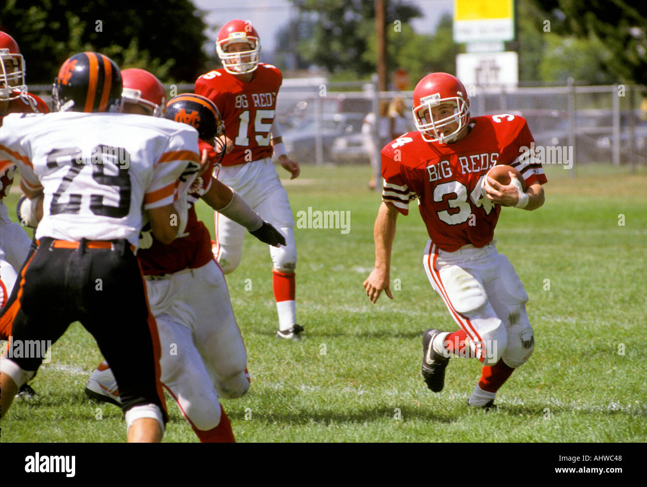 High school football action with halfback running the ball Stock Photo ...