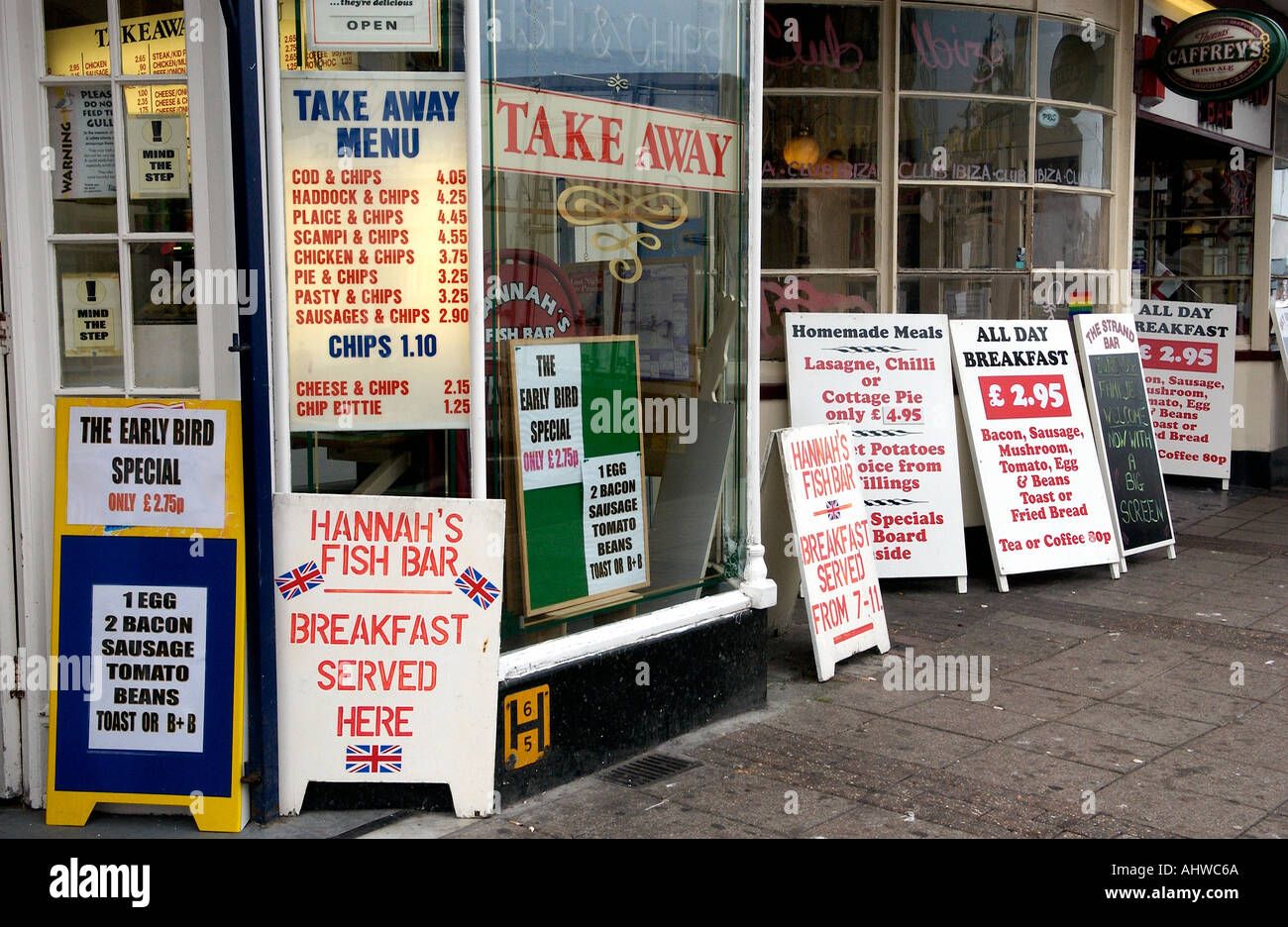 Notices outside a Fish and Chip shop on the seafront at Torquay Torbay ...