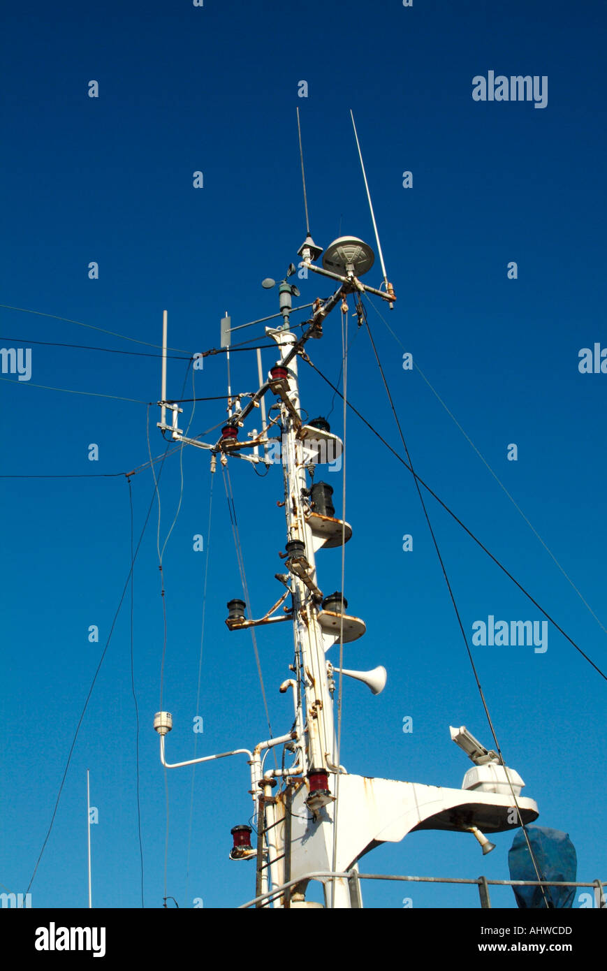 Ships communication mast against blue sky Stock Photo - Alamy