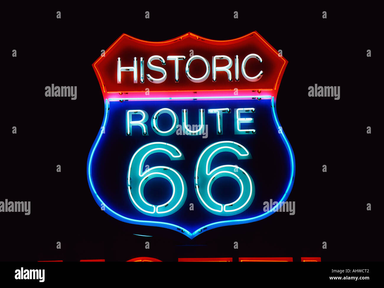 This is a road sign that says Historic Route 66 It is a neon sign in ...