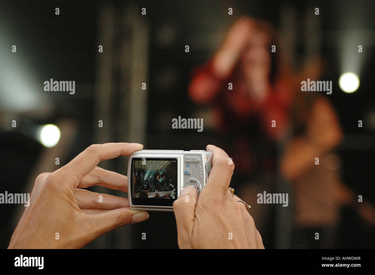 spectator taking snapshot at rock concert with digital camera Stock ...