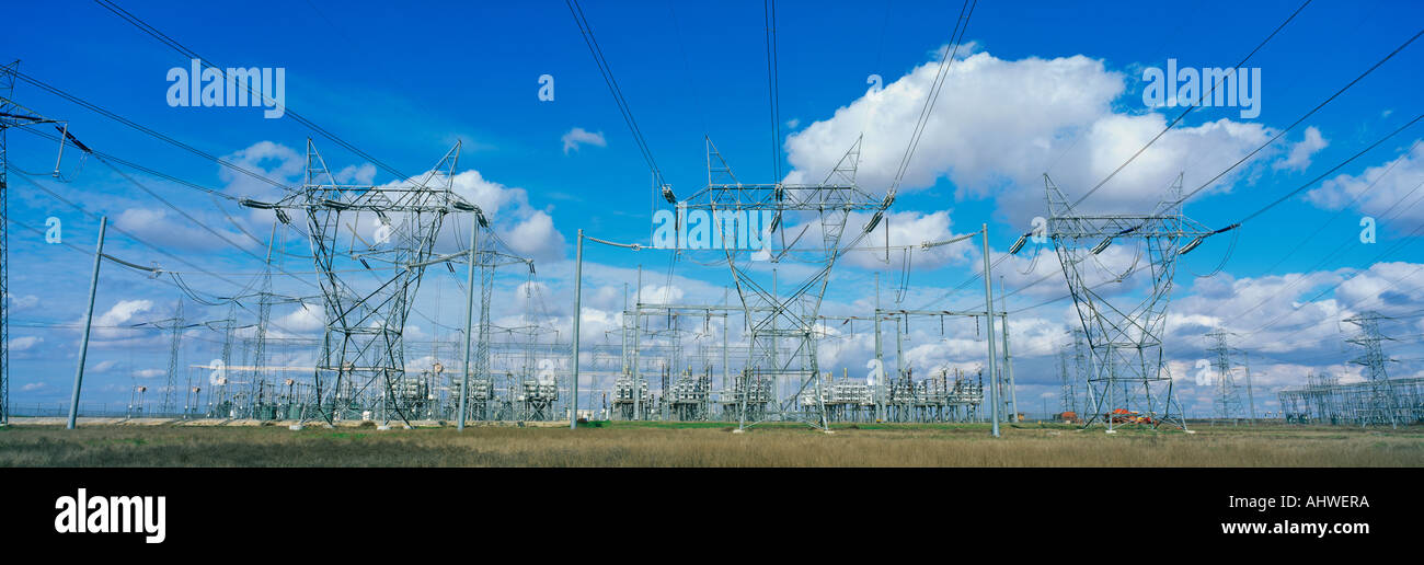 These are electrical utility lines set against a blue sky with white ...