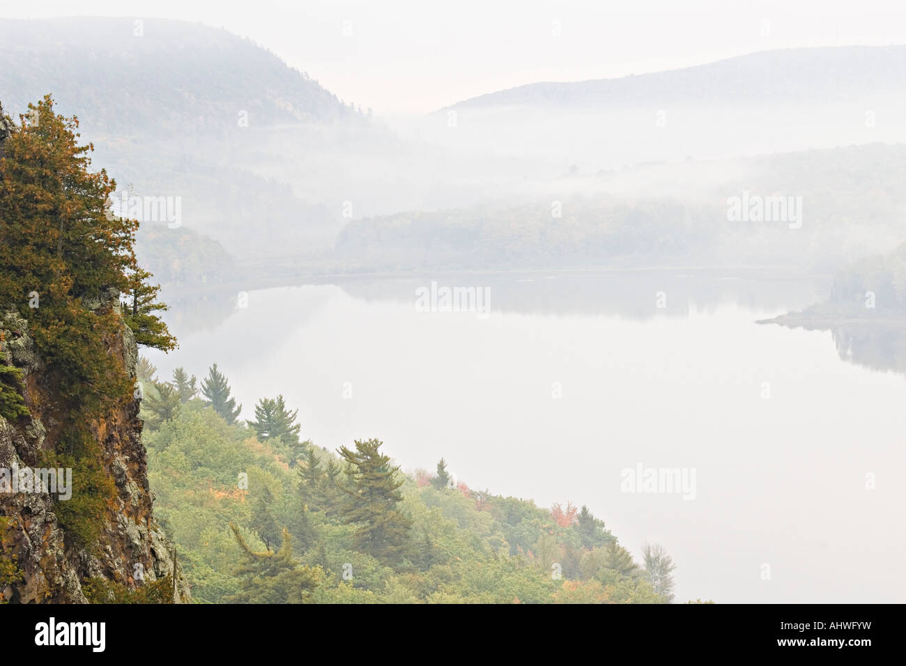 Foggy fall color morning at the Lake of the Clouds overlook in ...