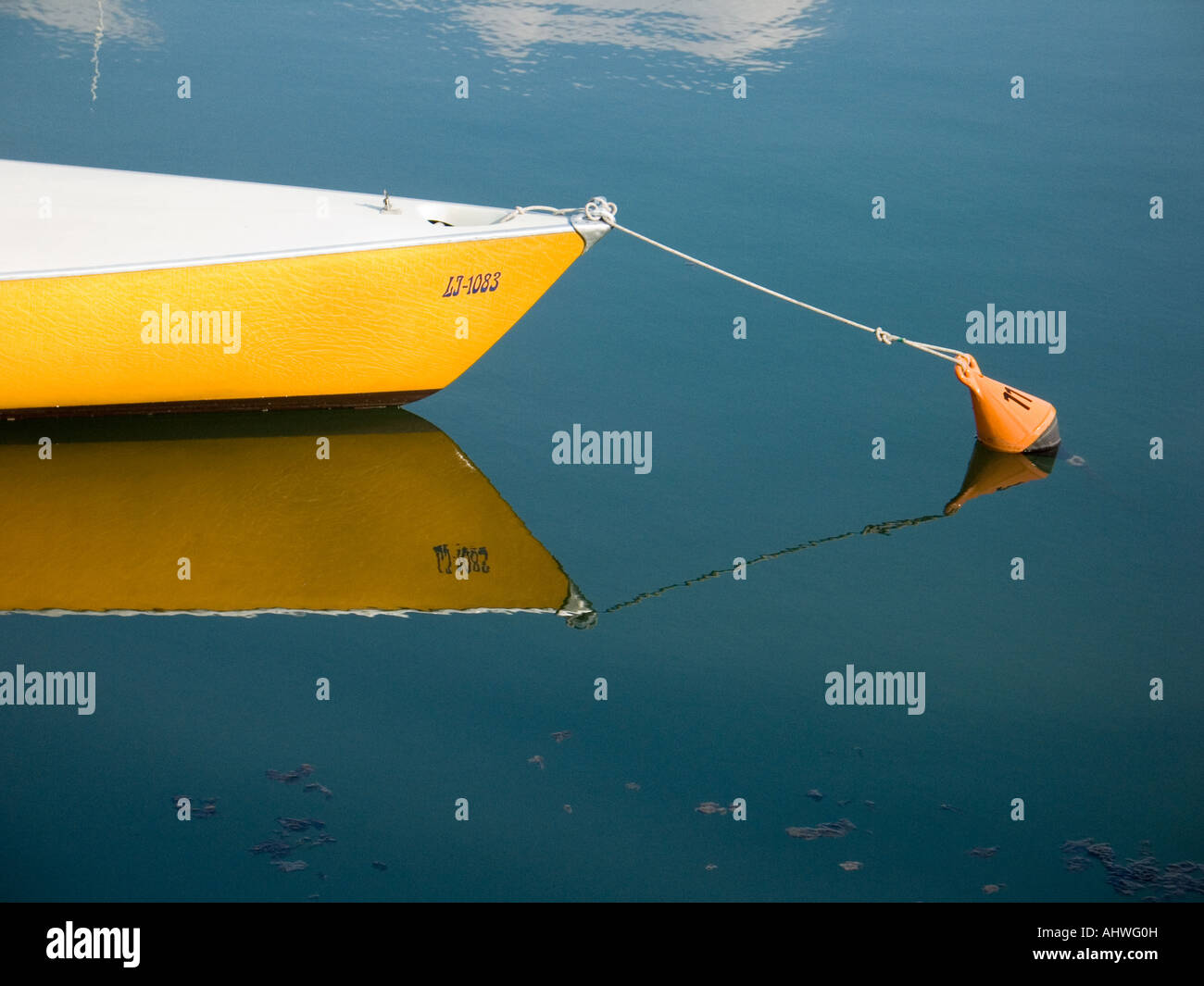 rowing boat anchored in the harbour Stock Photo - Alamy