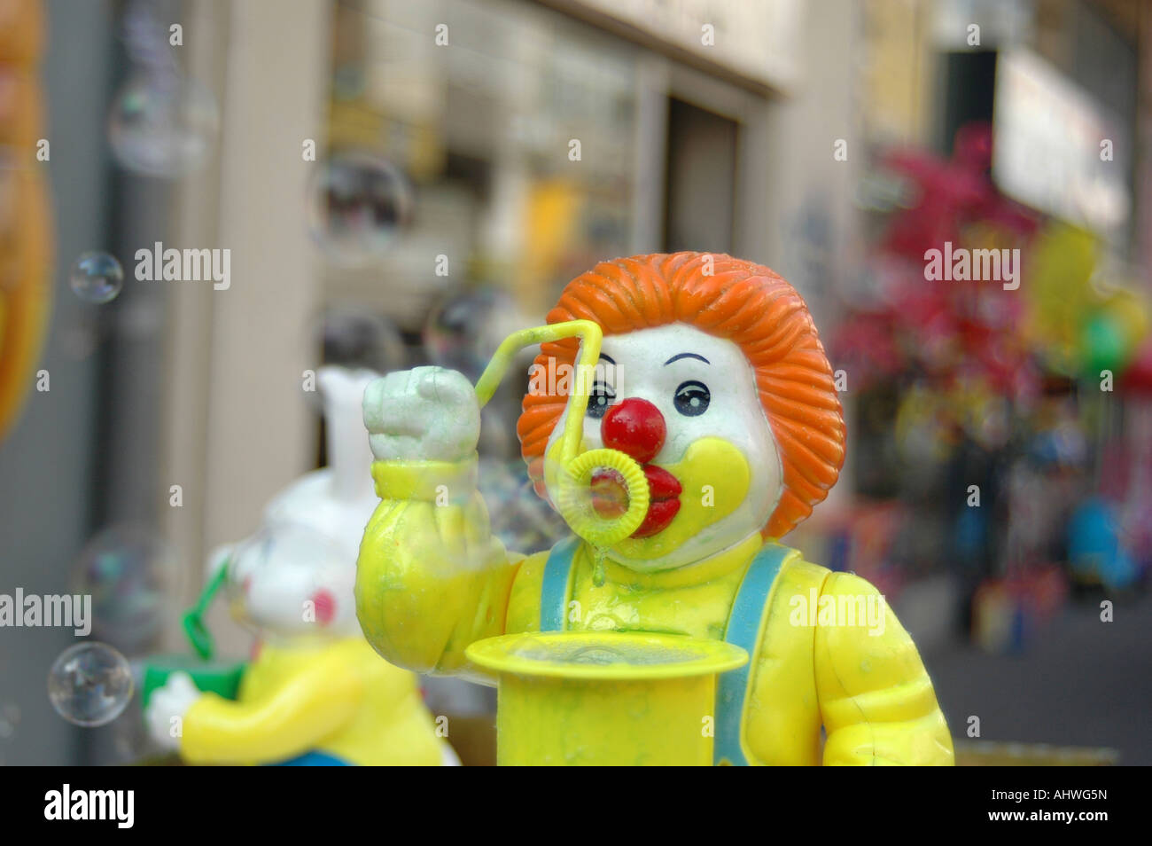 Toy clown blowing soap bubbles Stock Photo - Alamy
