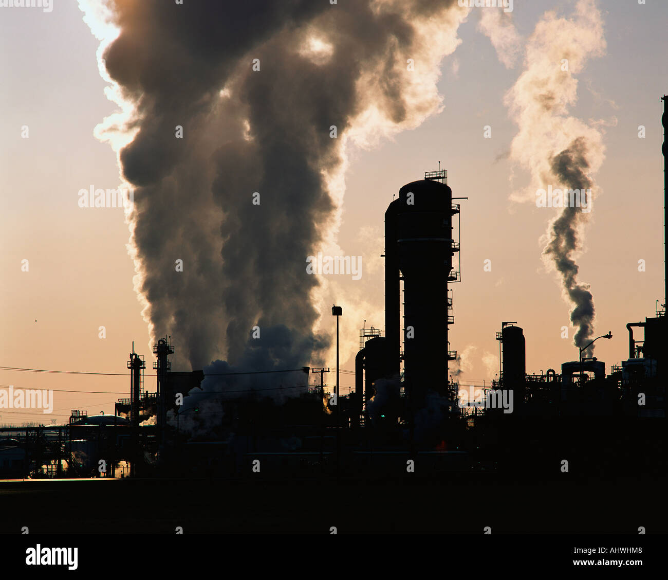 This is an image of an industrial plant pushing billowing stacks of ...