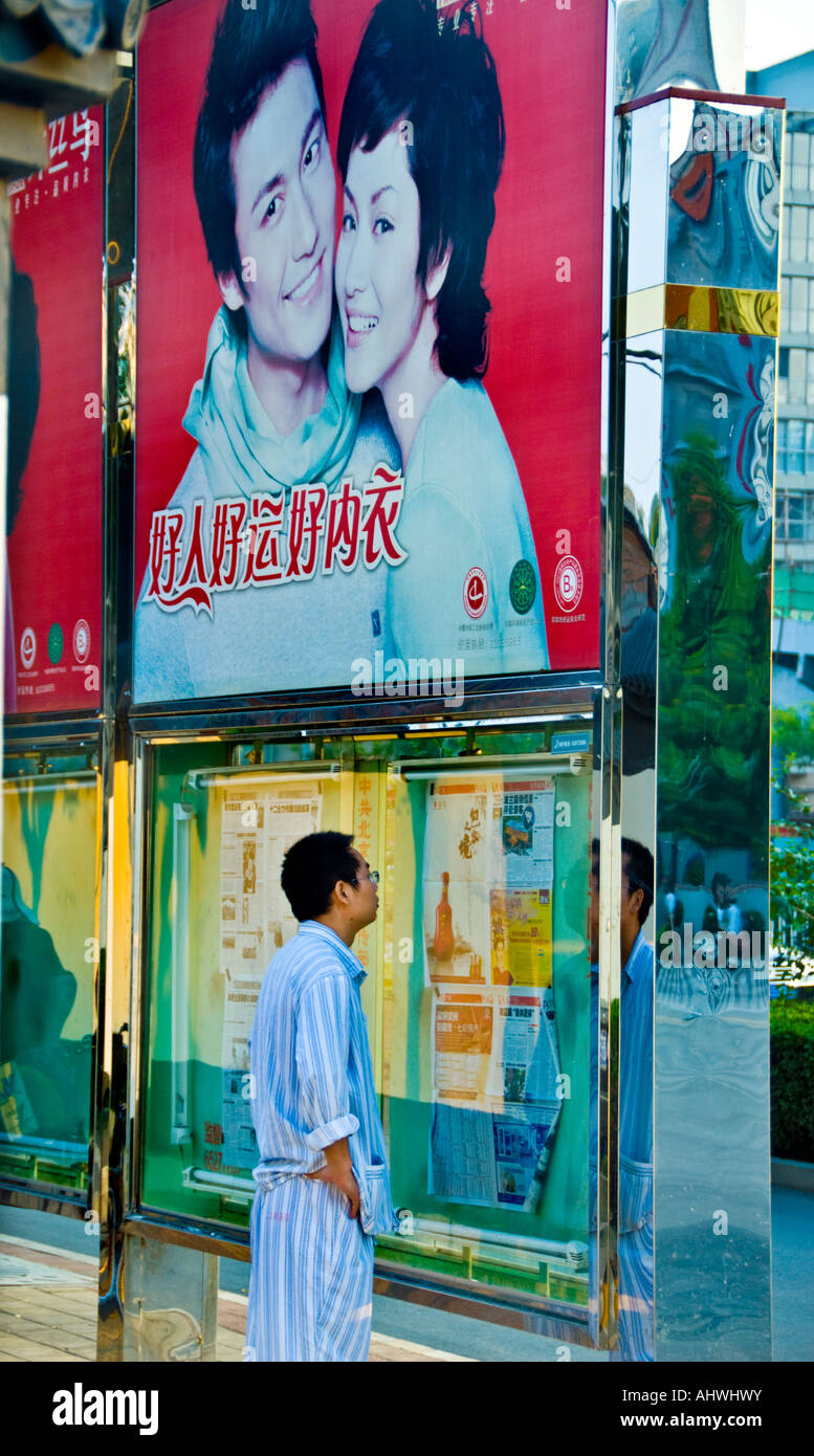 Beijing CHINA, Chinese Man Reading Newspaper on Billboard on Street in ...