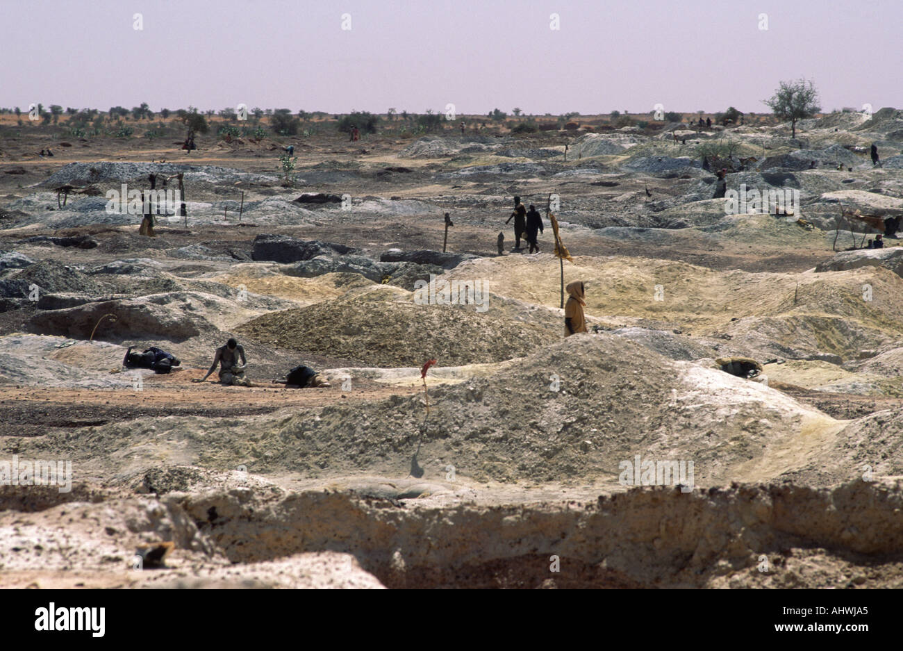 The spoil tips and miners at artisanal goldmines, Essakane, Burkina ...