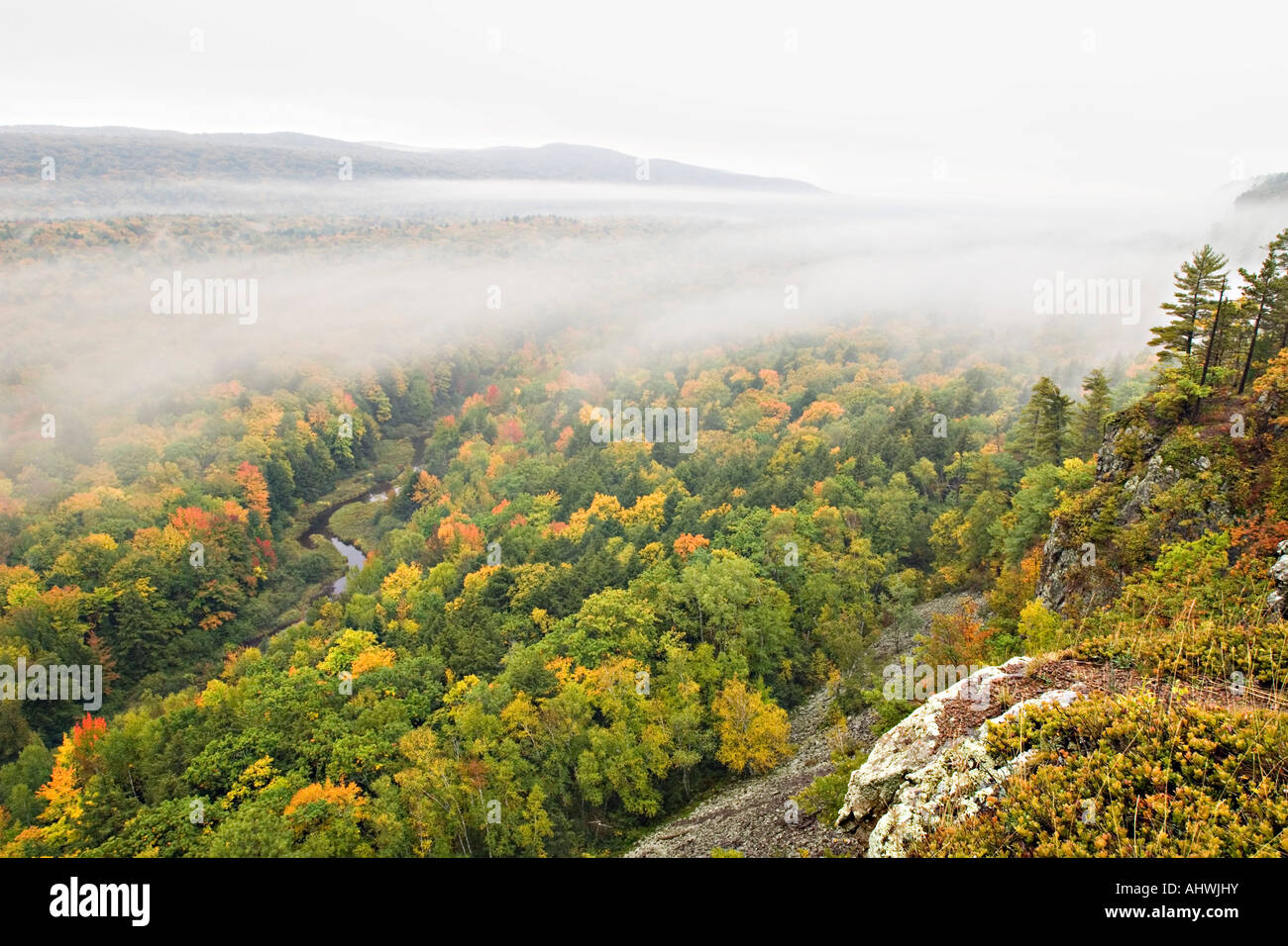Foggy fall color morning at the Lake of the Clouds overlook in ...