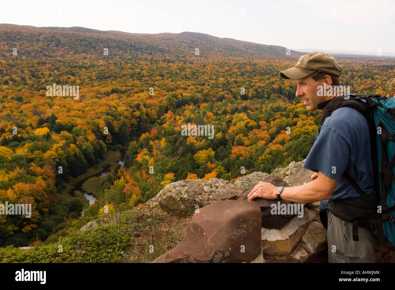 A backpacker at Porcupine Mountains State Park in fall in Michigan ...