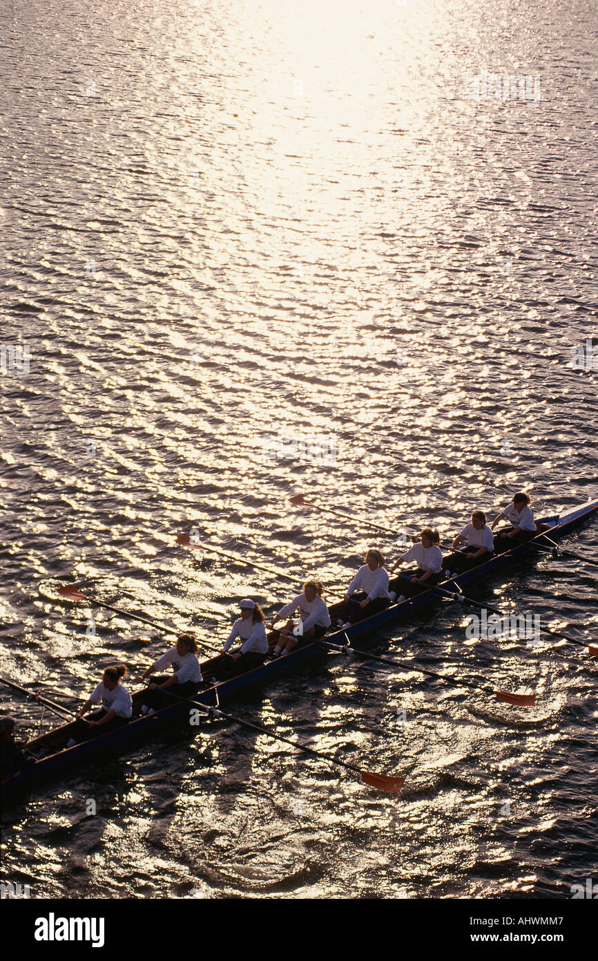 Crew team rowing in water Stock Photo - Alamy