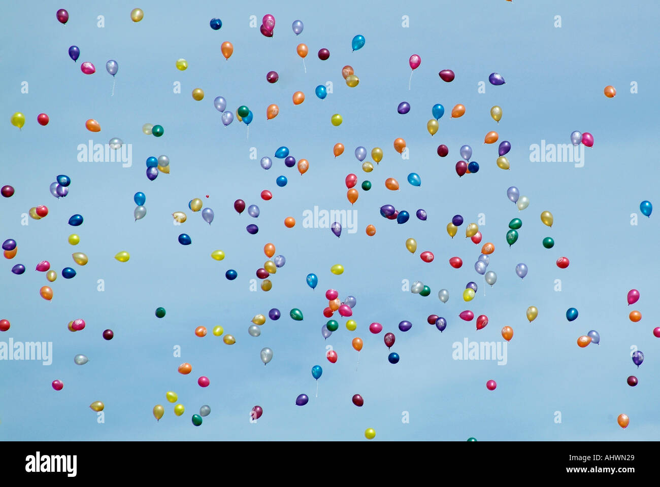 Balloons fill the sky after being released at a parade Stock Photo - Alamy