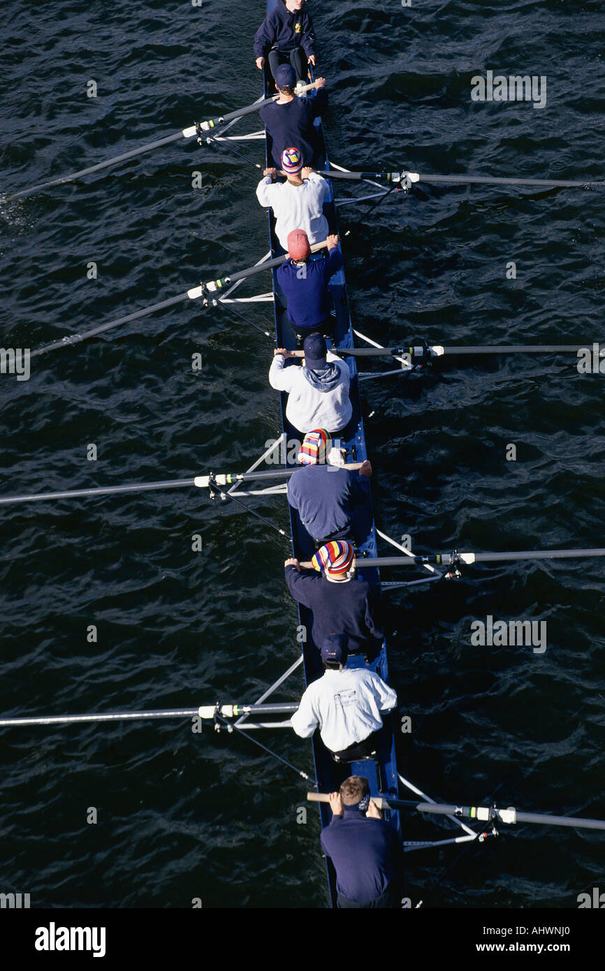 Crew team rowing on water Stock Photo - Alamy