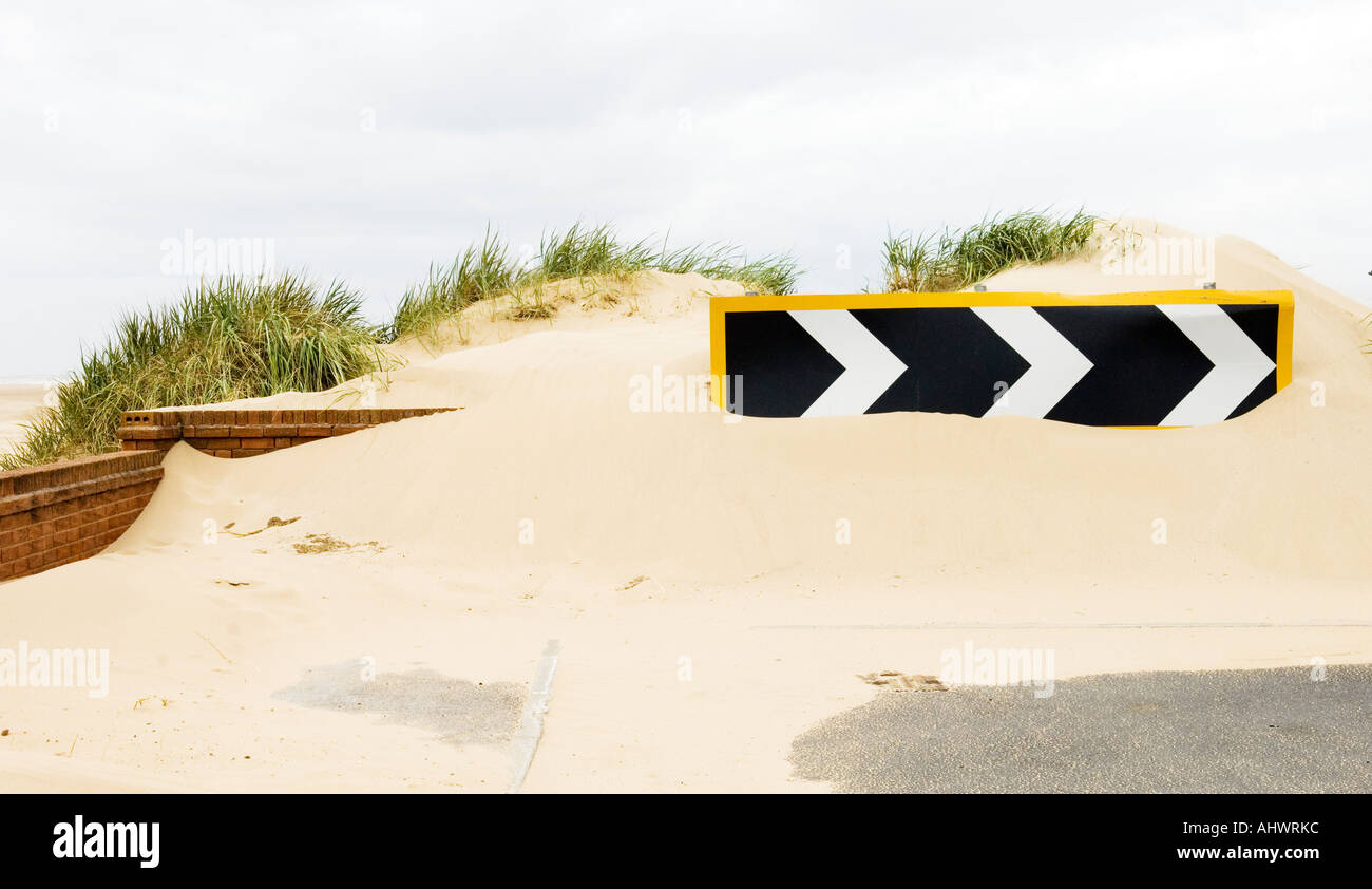 Sand blown from dunes on to road sign Stock Photo - Alamy