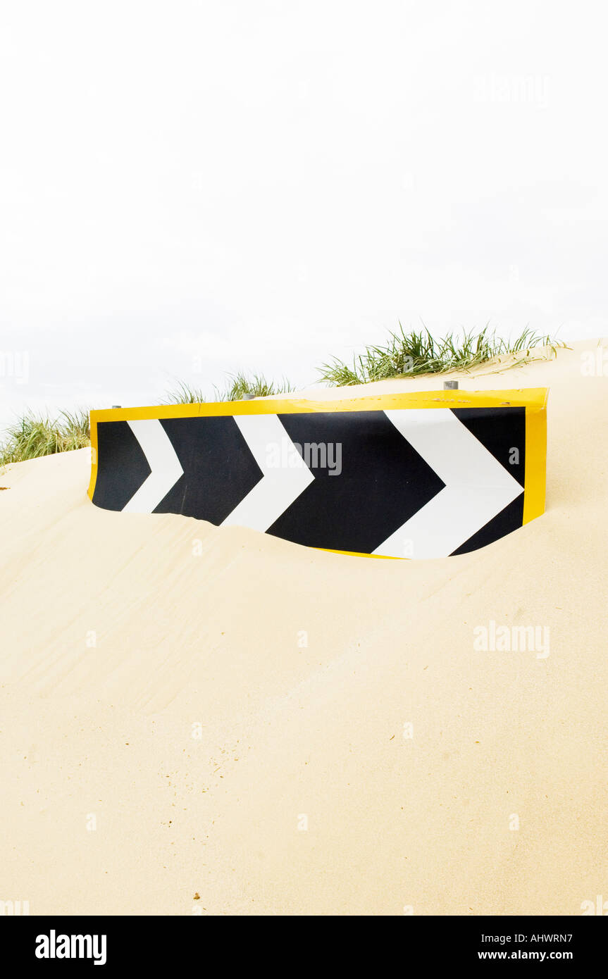 Sand blown from dunes on to road sign Stock Photo - Alamy