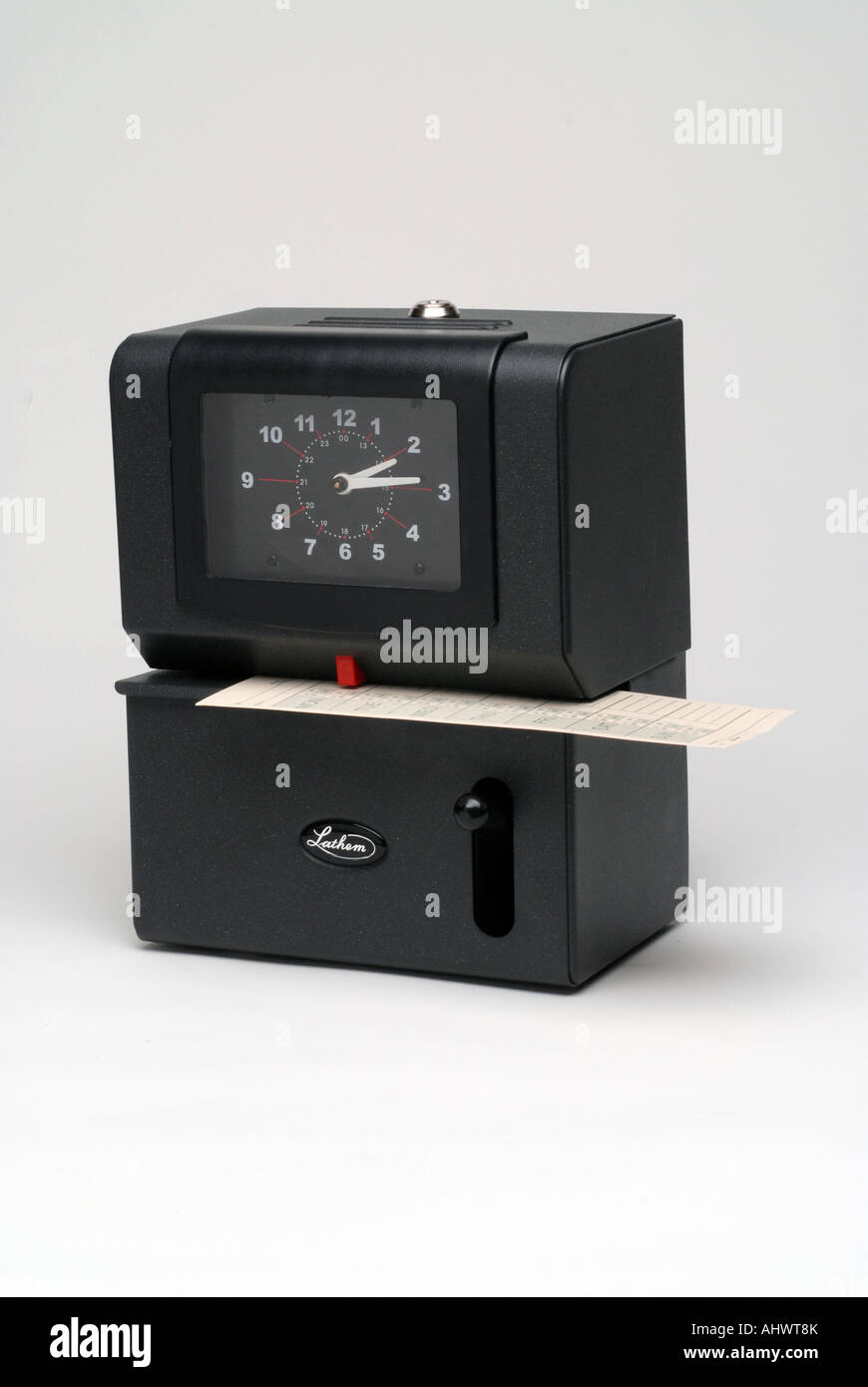 Electronic time clock on white seamless with time card in place Stock ...