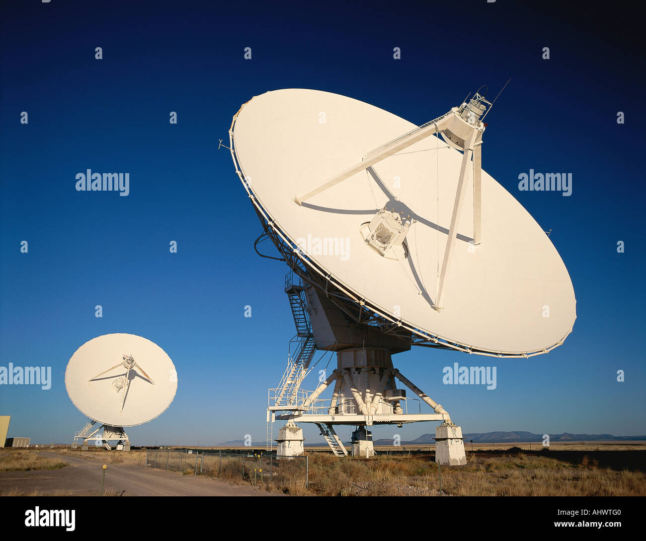Two VLA Very Large Array radio telescope dishes facing up Stock Photo ...