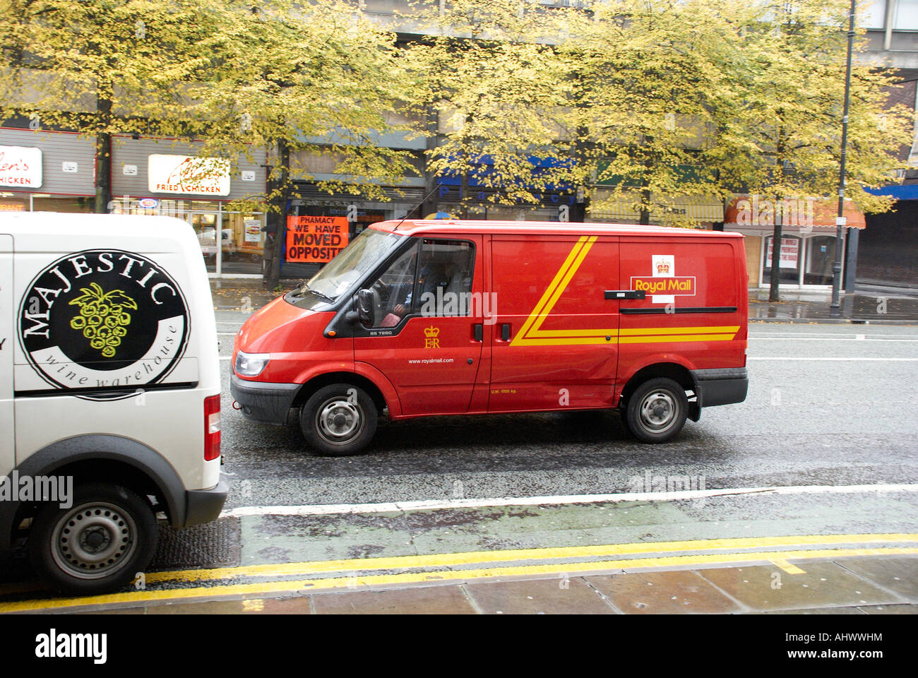 royal mail driving through a rainy manchester Stock Photo - Alamy