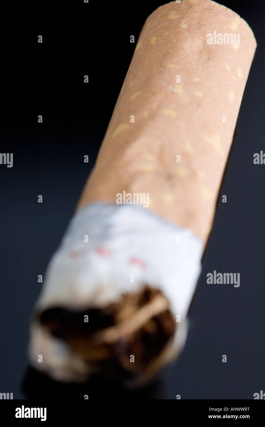 cigarette butt filter close up on black background 2 of 5 Stock Photo ...