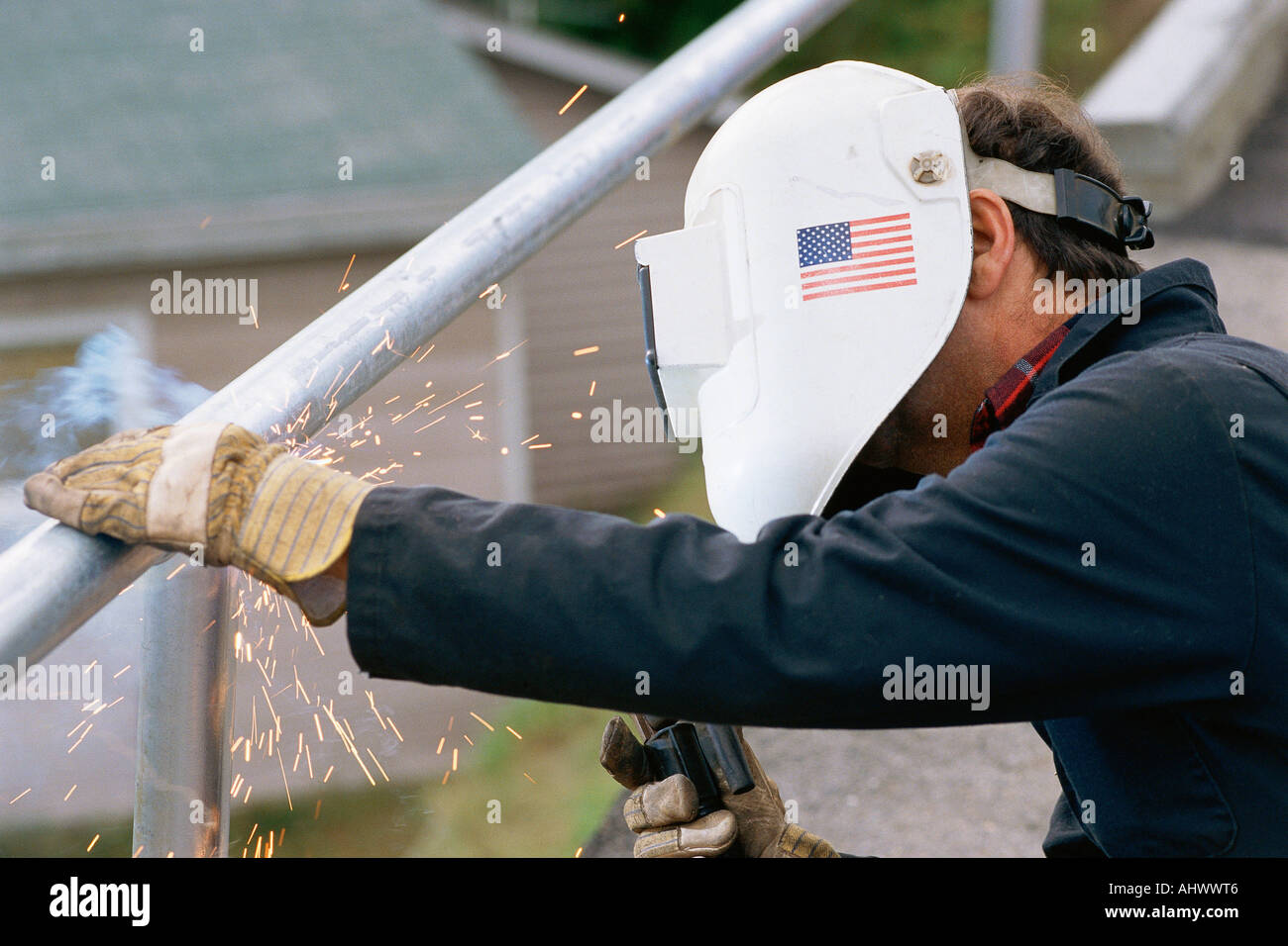 Man welding steel railing Stock Photo - Alamy