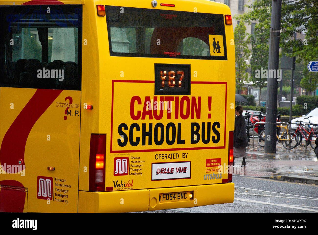 yellow school bus in central Manchester, England Stock Photo - Alamy