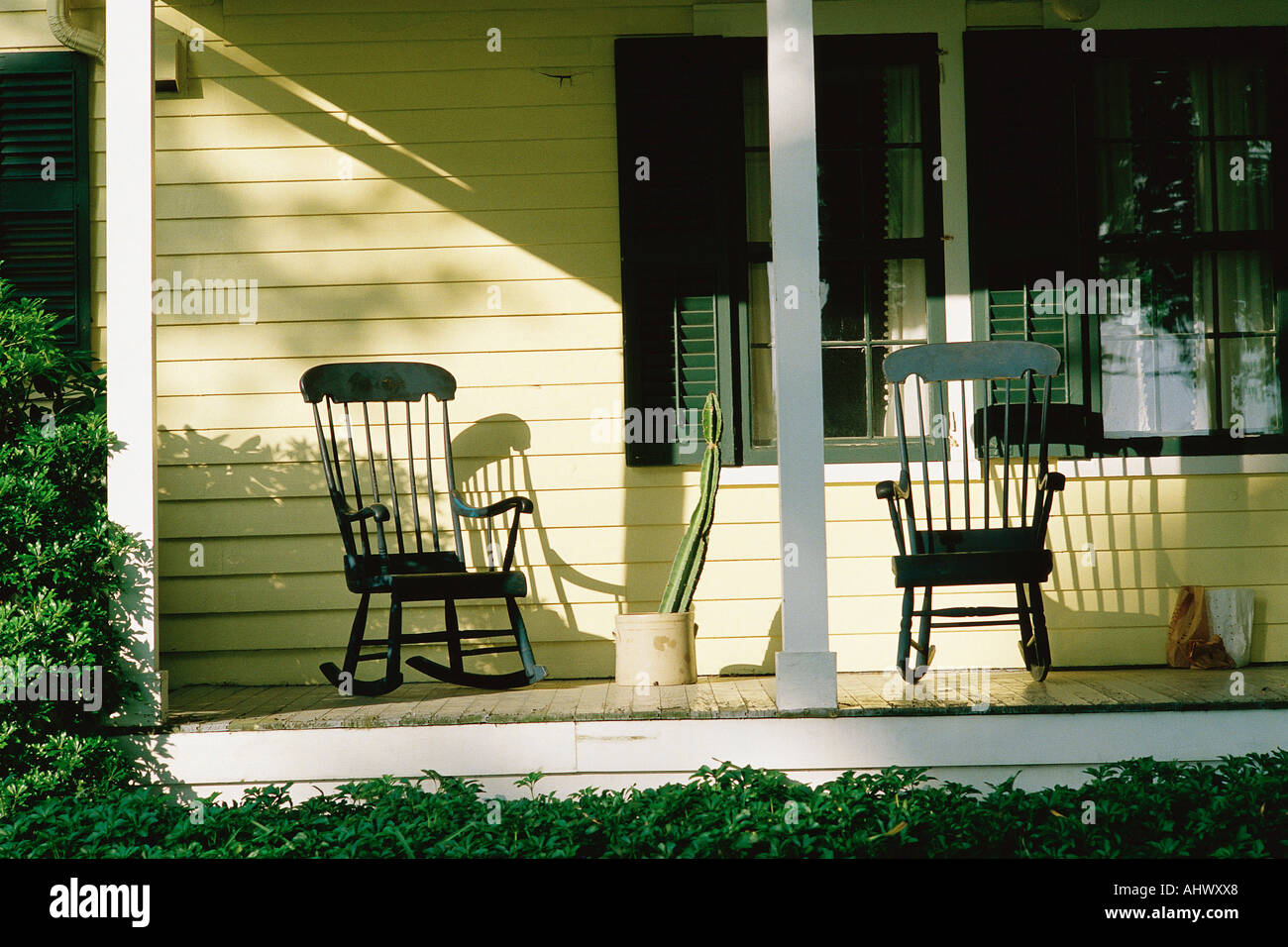 Front porch of house with rocking chairs Stock Photo - Alamy