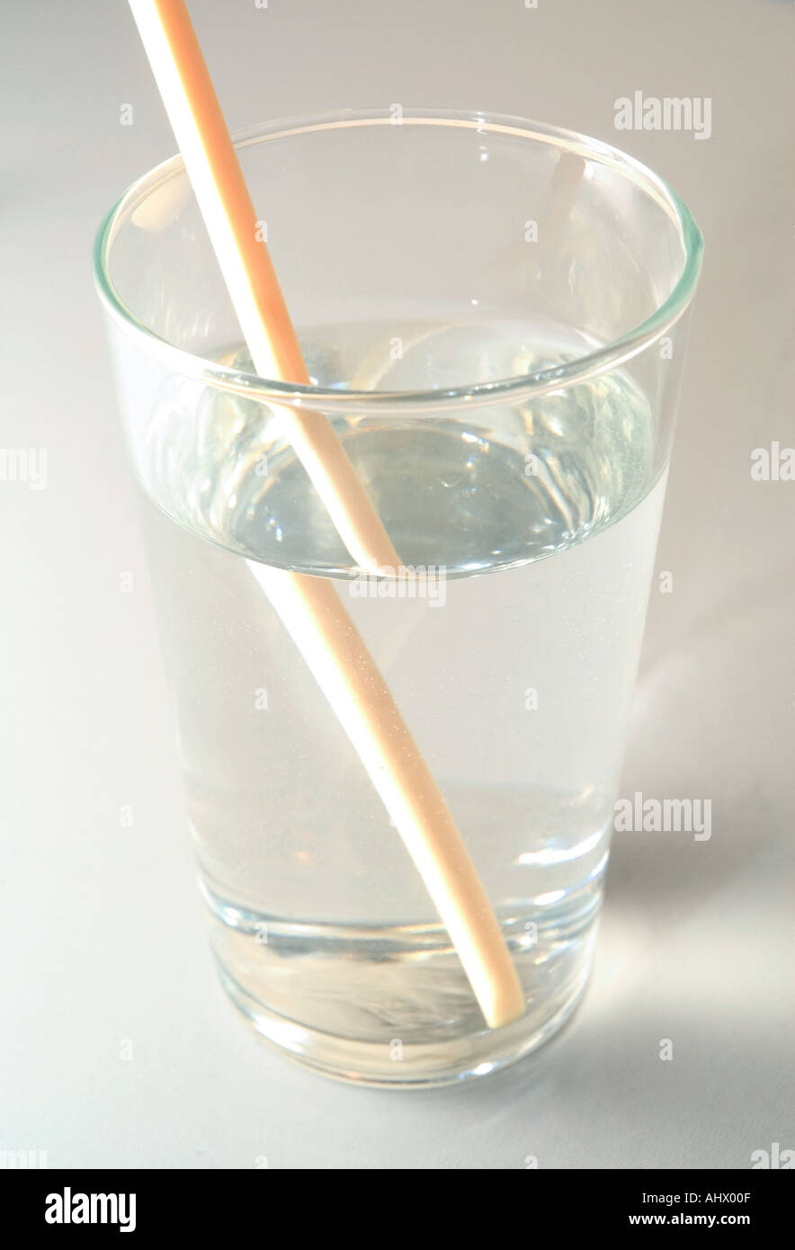 Diffraction of water shown by chopsticks in a glass of water Stock ...