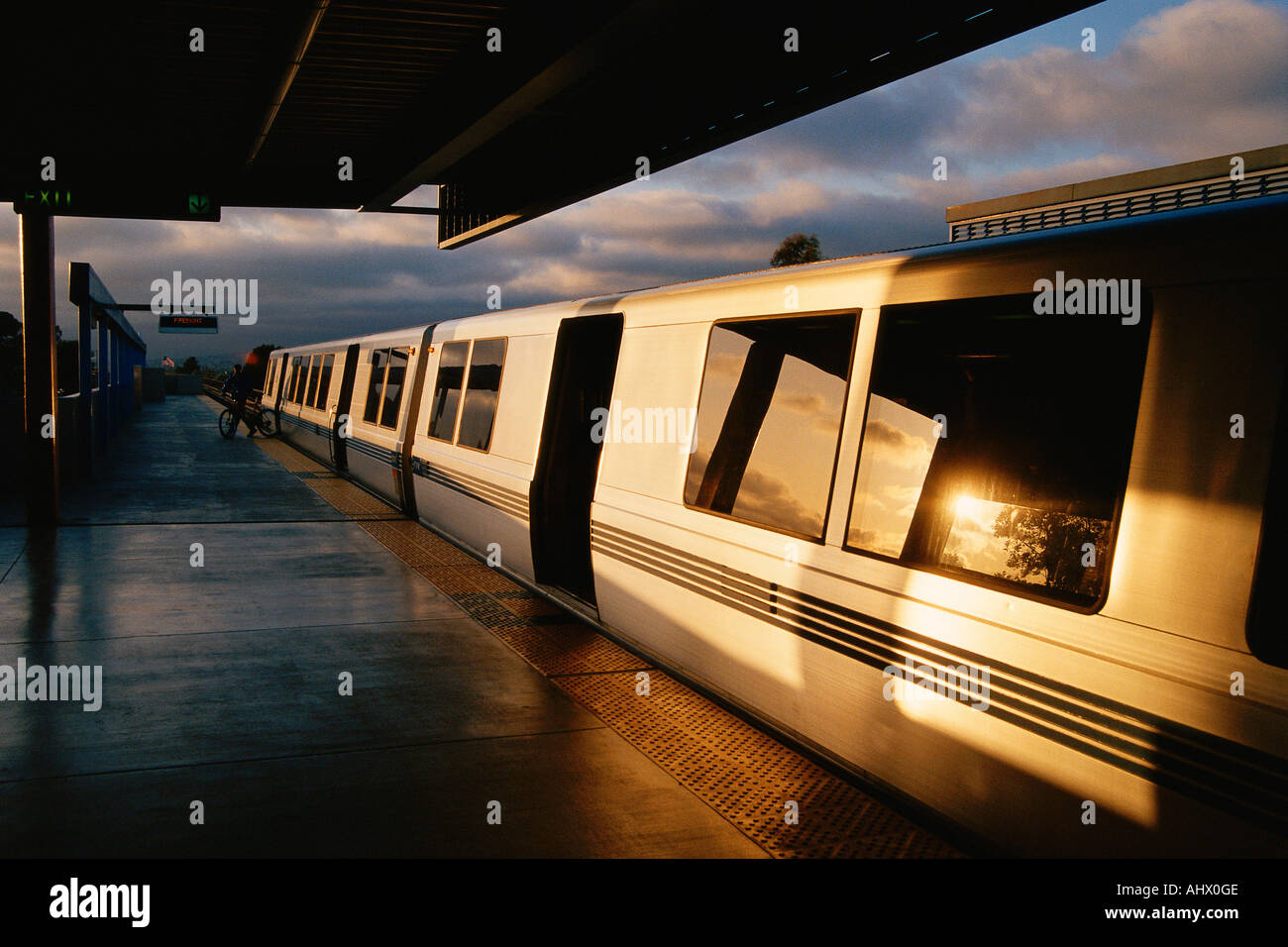 High speed train in afternoon sun Stock Photo - Alamy