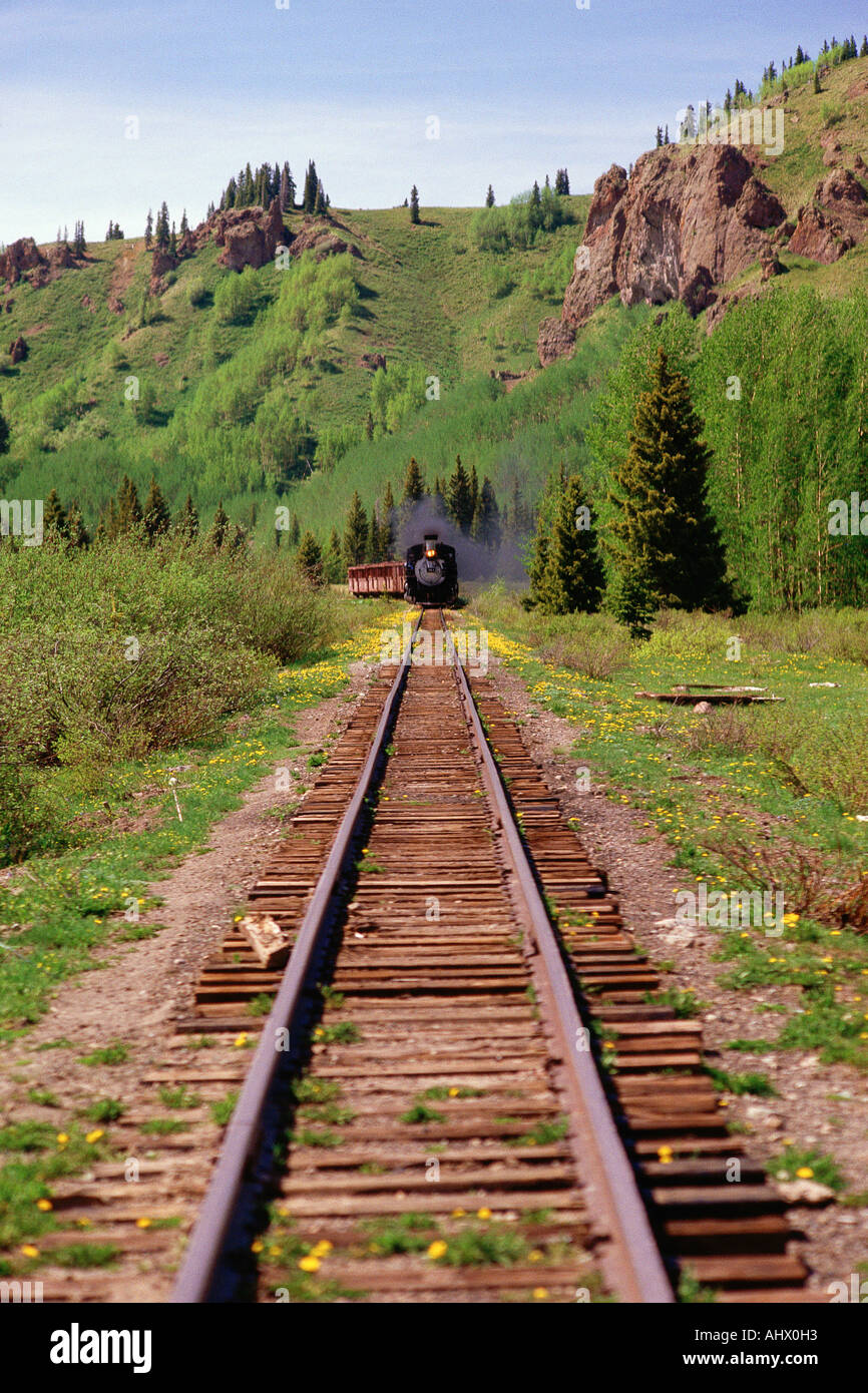 Train coming down track Stock Photo - Alamy