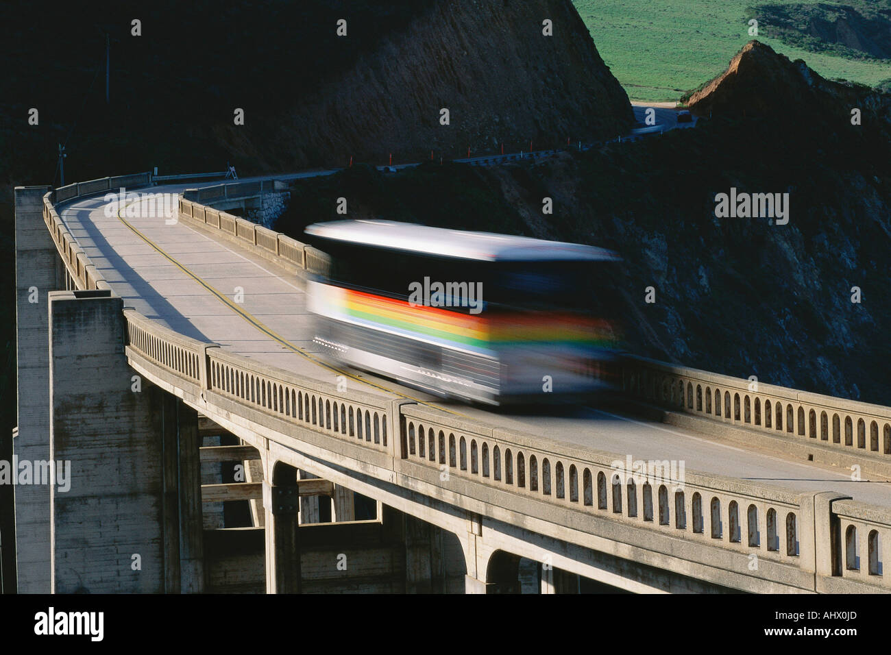 Bus traveling across bridge Stock Photo - Alamy