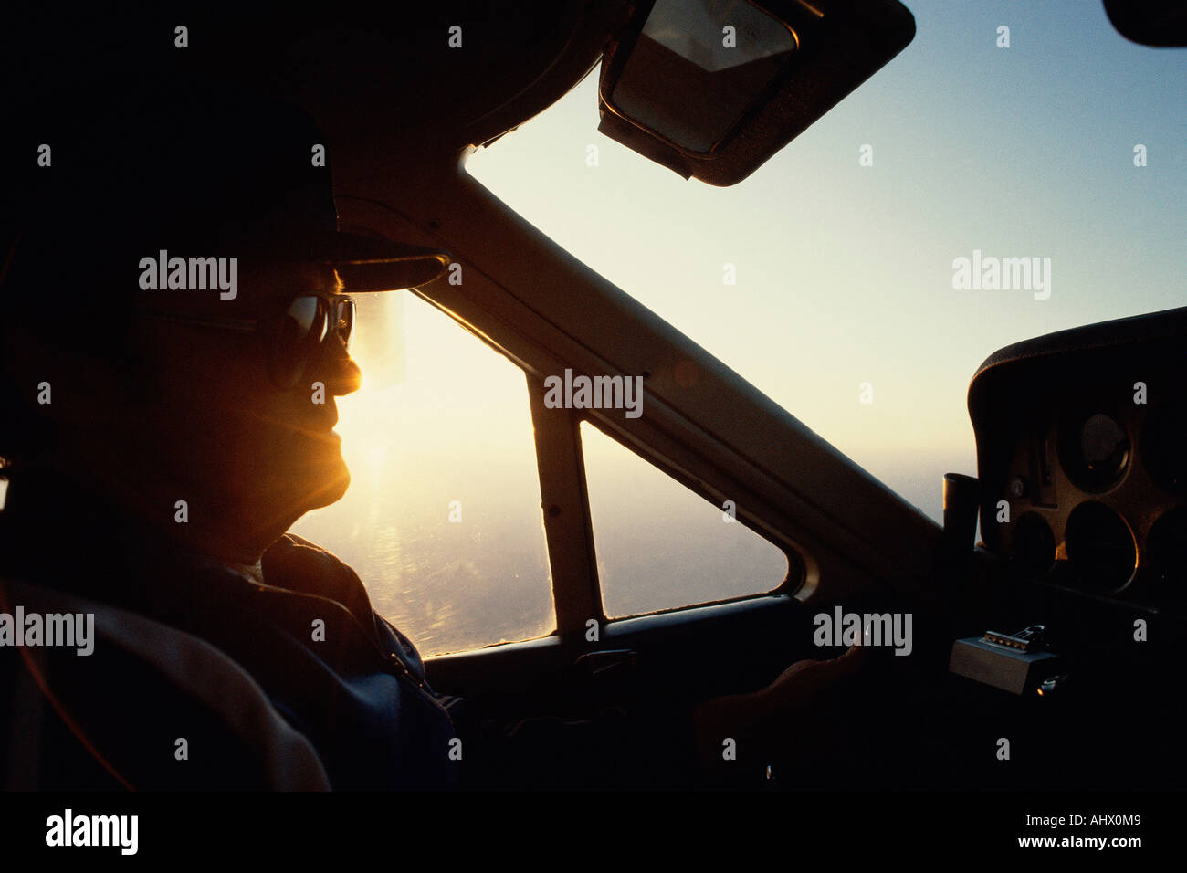 Pilot at aircraft controls Stock Photo - Alamy