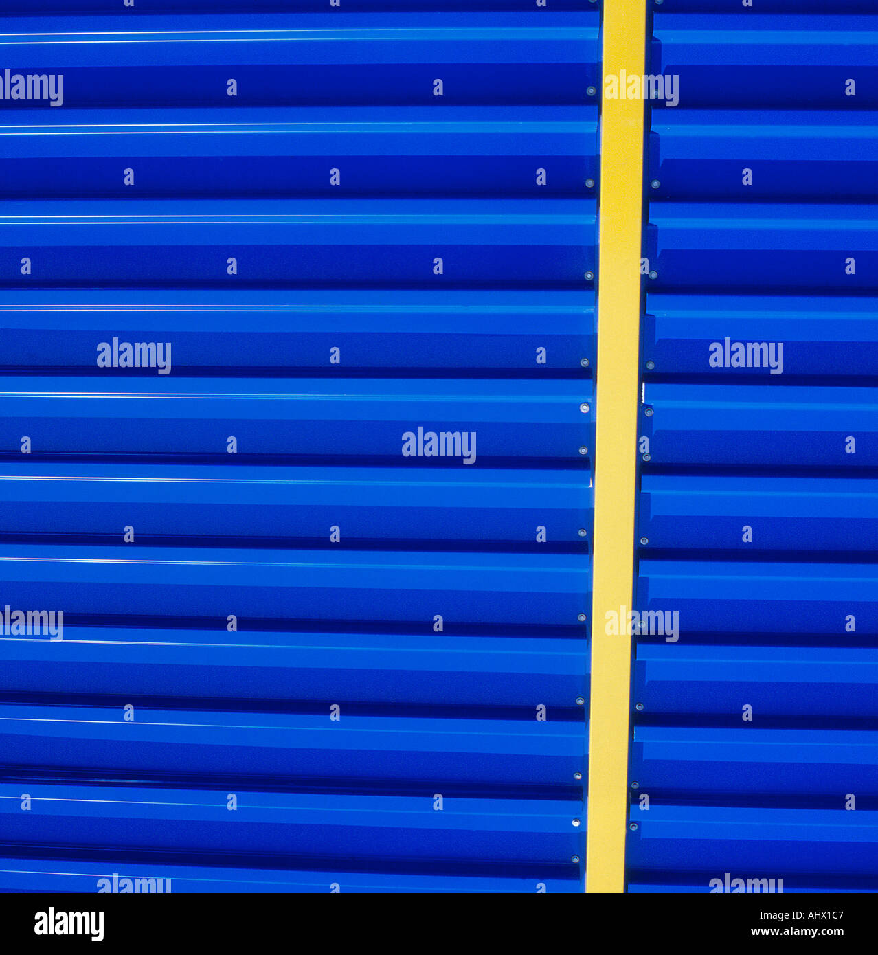 architecture blue building with yellow line. Photo by Willy Matheisl ...