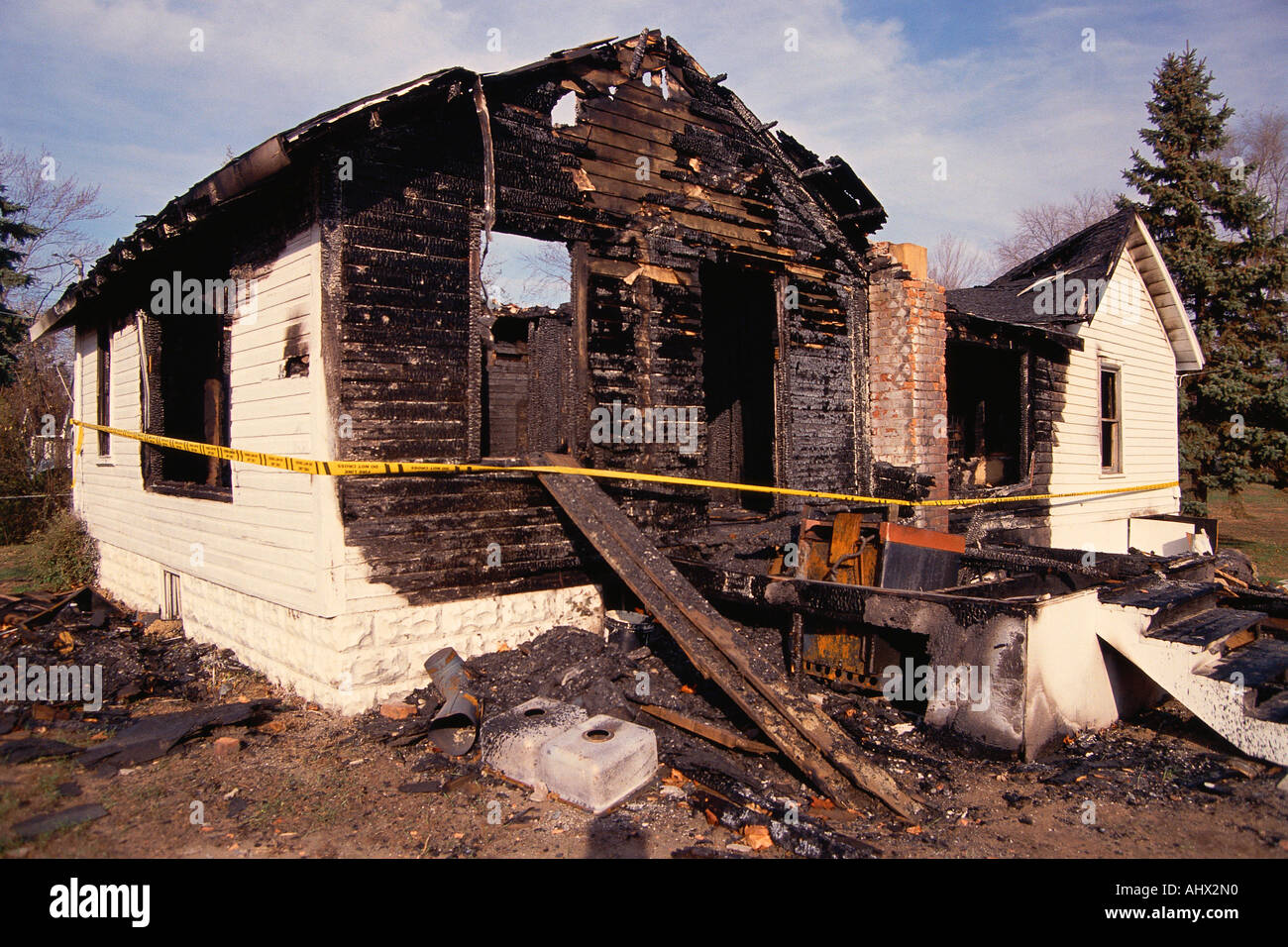 Charred house and rubble Stock Photo - Alamy