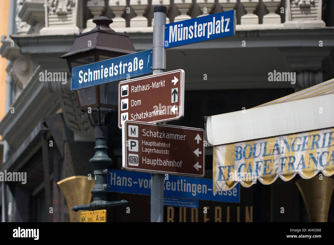 road signs at a multiple junction with arrows pointing out in all ...