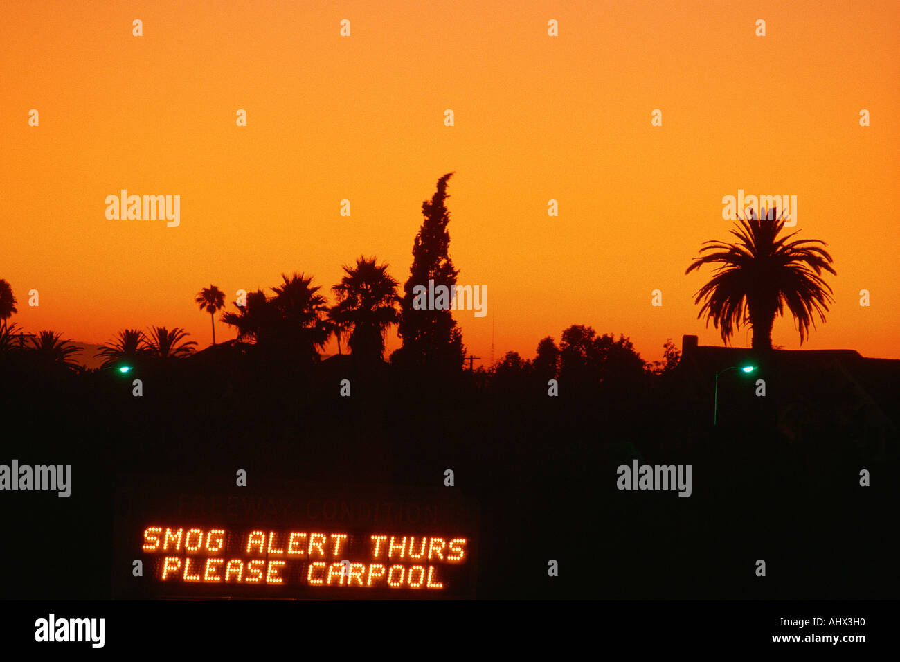 Smog alert sign against Los Angeles silhouette Stock Photo - Alamy