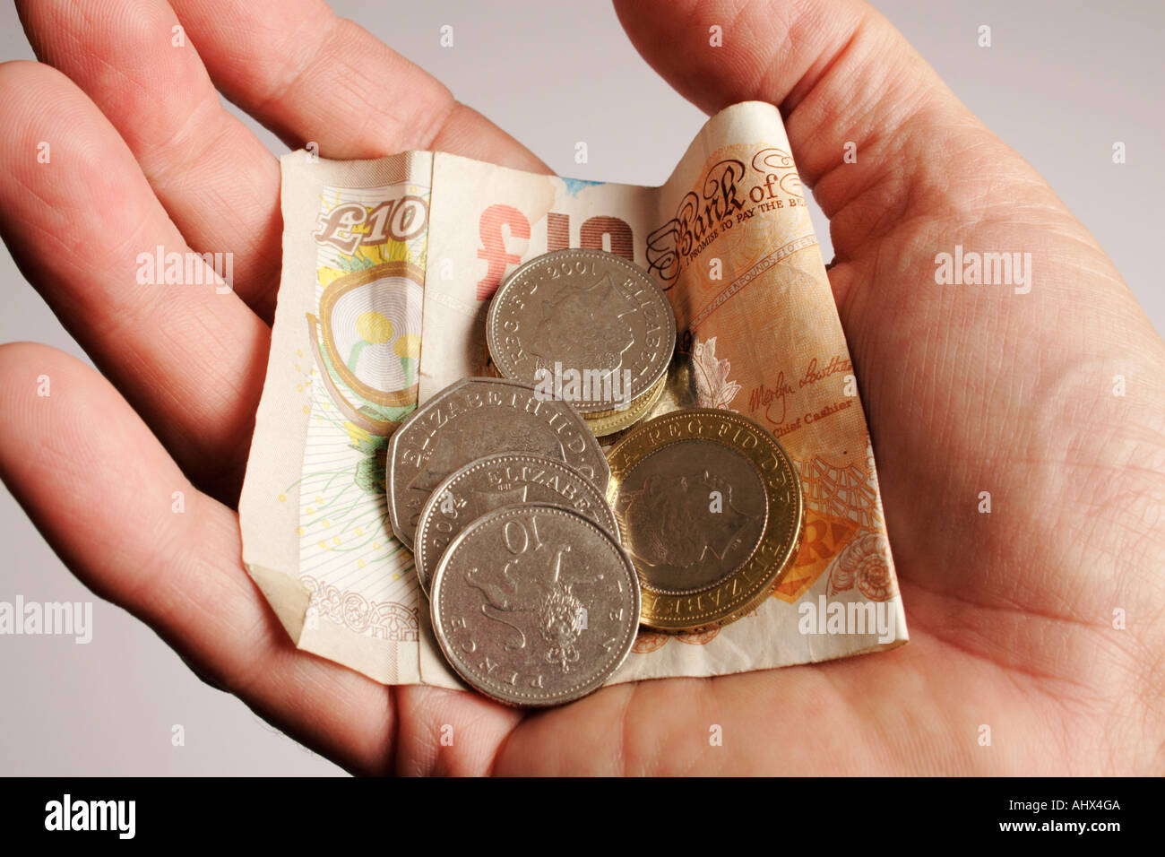 Cash in hand, British Pounds Stirling Stock Photo - Alamy