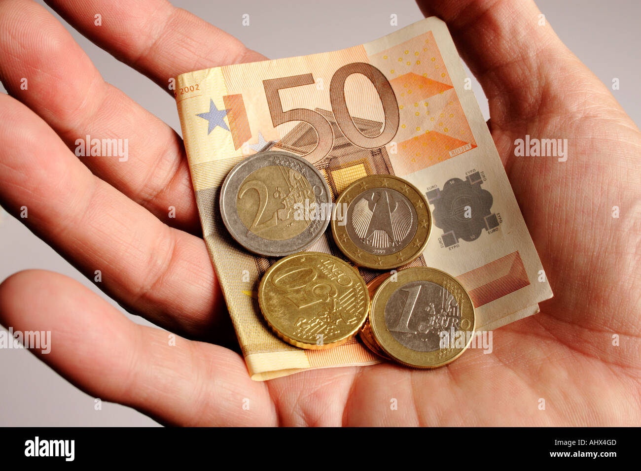 Cash in hand, Euro Stock Photo - Alamy