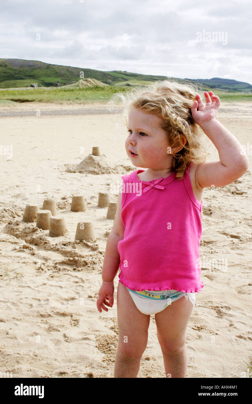 Little Girl on a sandy beach Stock Photo - Alamy