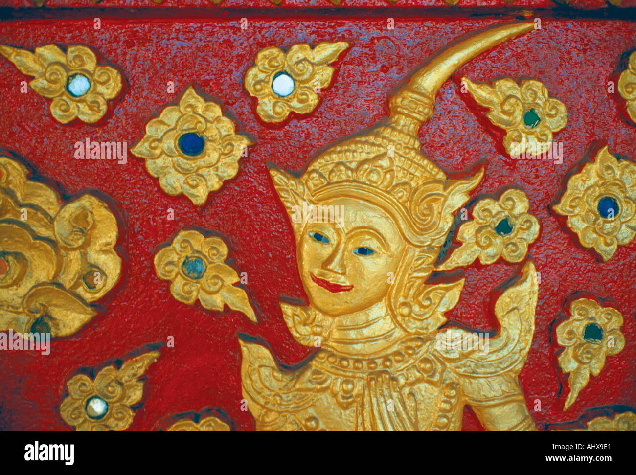 Thai Buddhist tapestry red gold Stock Photo - Alamy