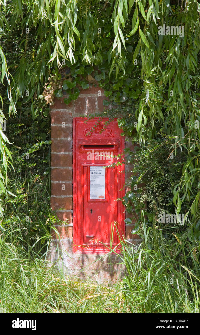 Traditional Red British Royal Mail Post Box Set in Wall and Surrounded ...