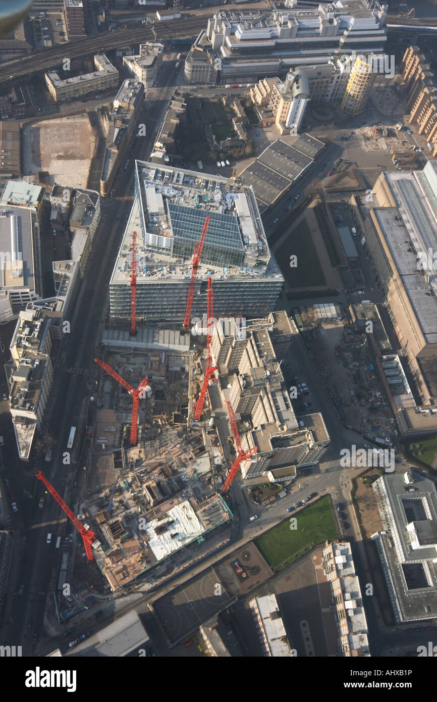 High level oblique aerial view west of building site at Sumner St ...
