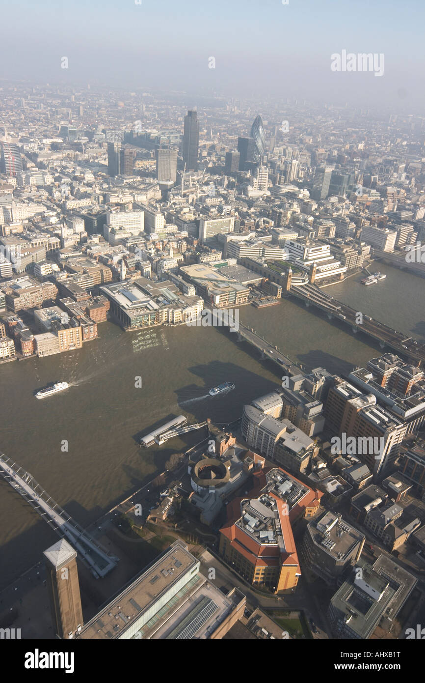High level oblique aerial view north of River Thames and City of London ...
