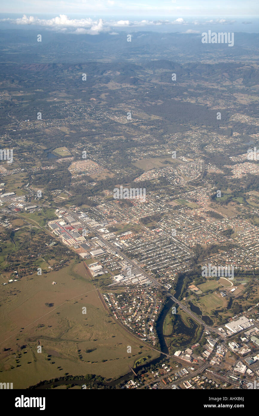 High level oblique aerial view of fields towns and houses from civil ...