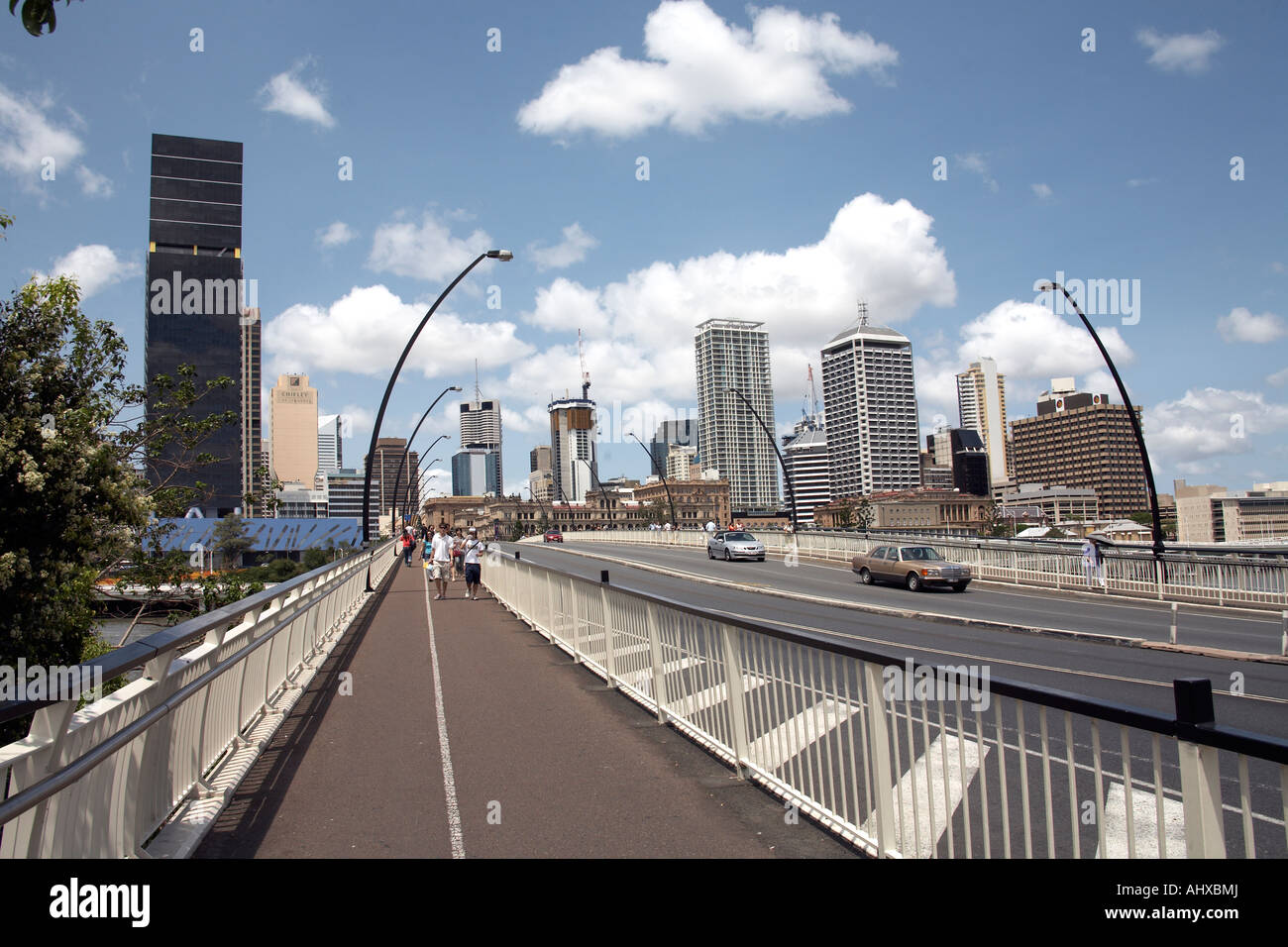 Pedestrian walkway of Victoria Bridge with Central Business District ...