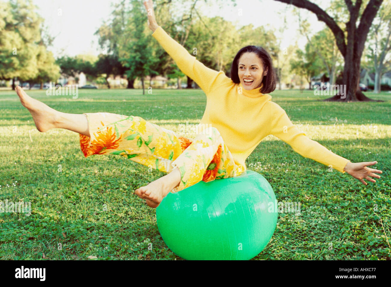 Woman balancing on swiss ball hi-res stock photography and images - Alamy
