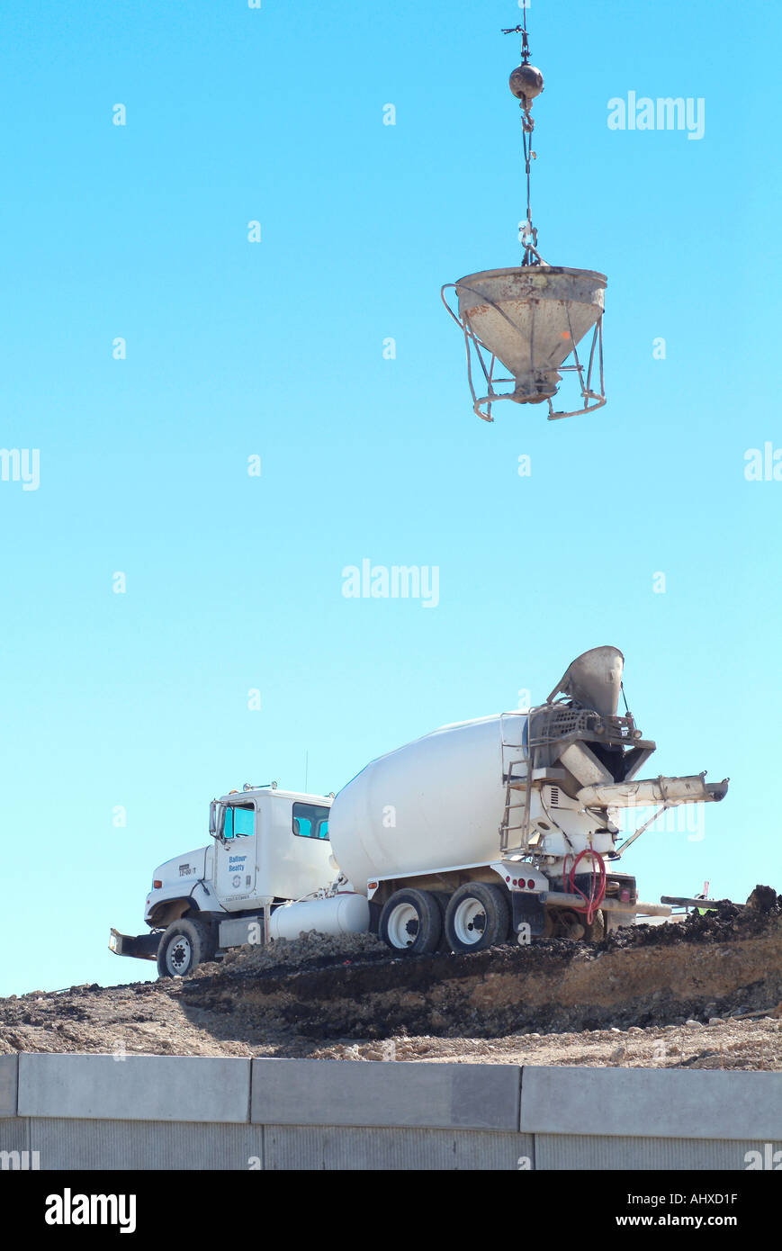 cement truck and crane pouring concrete Stock Photo - Alamy