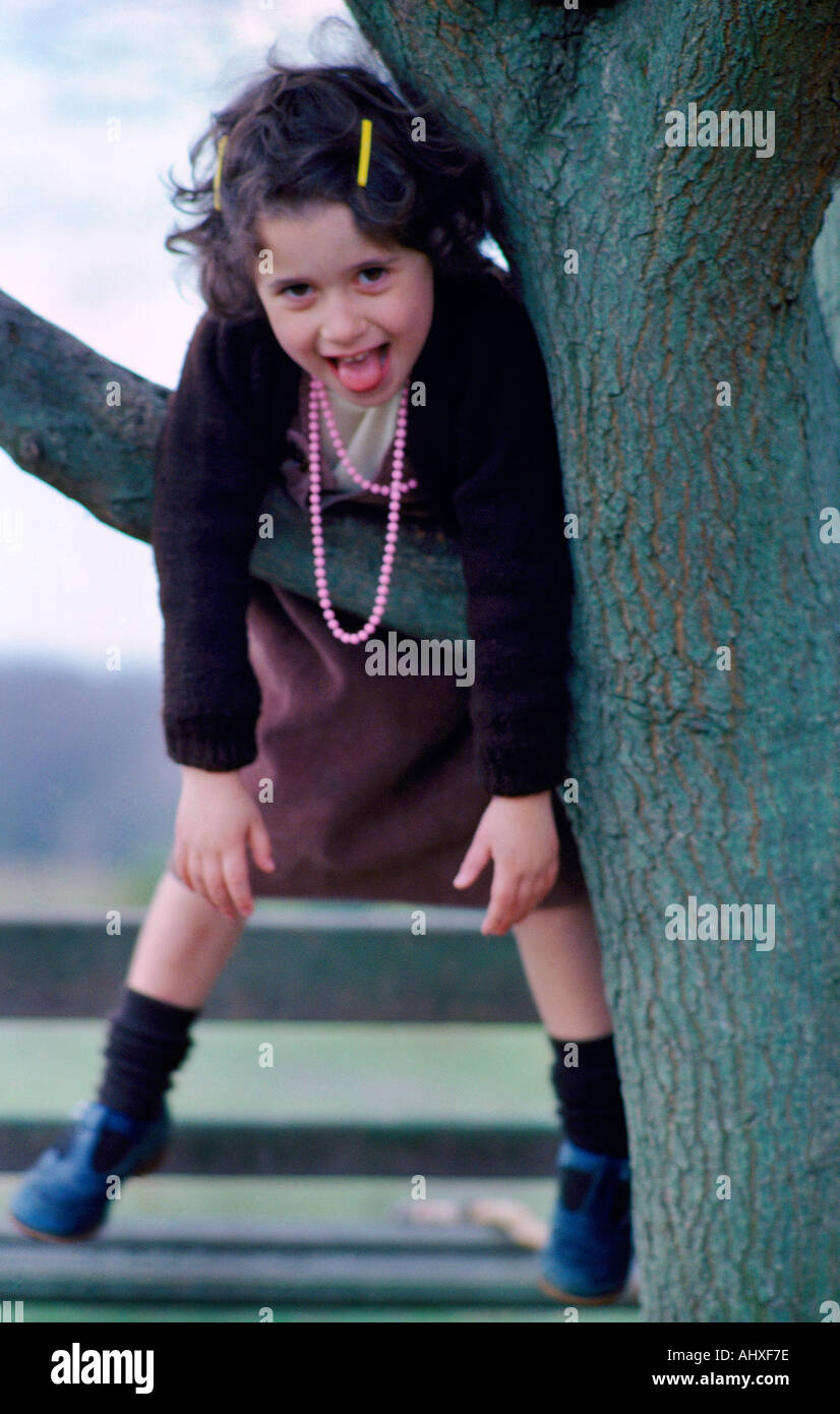 Child Climbing Tree Wearing Skirt Stock Photo - Alamy