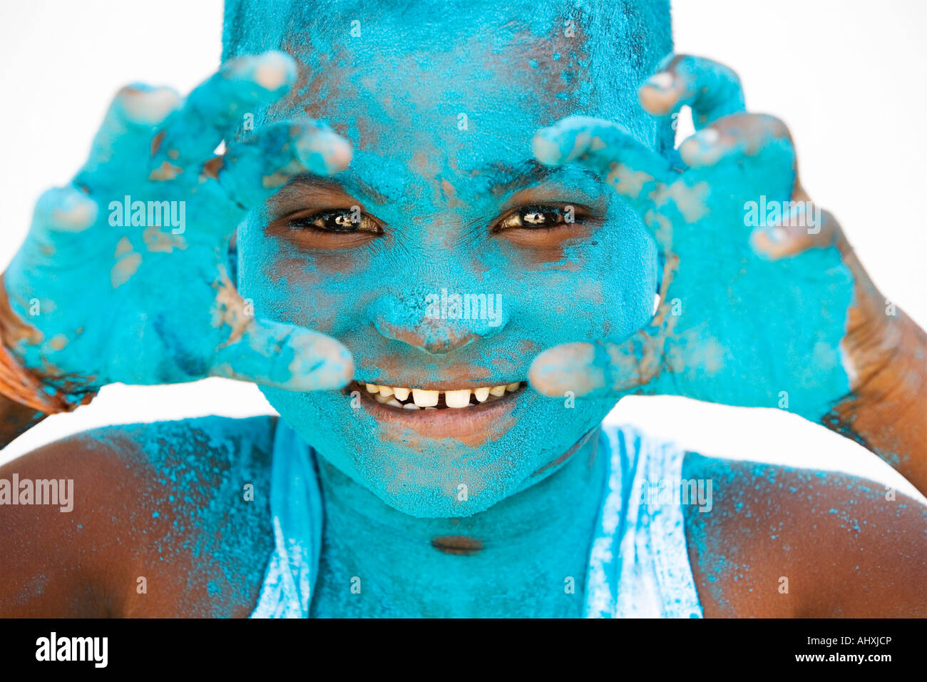 Young Indian boy covered in blue powder pigment. Portrait. India Stock ...