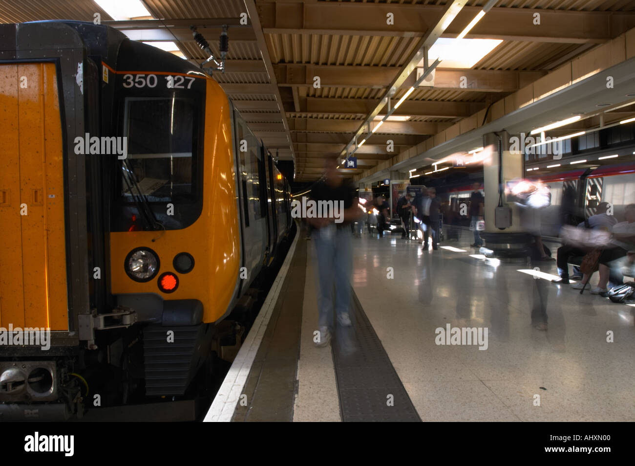 Euston Station platform Motion blur of passengers moving to and from ...